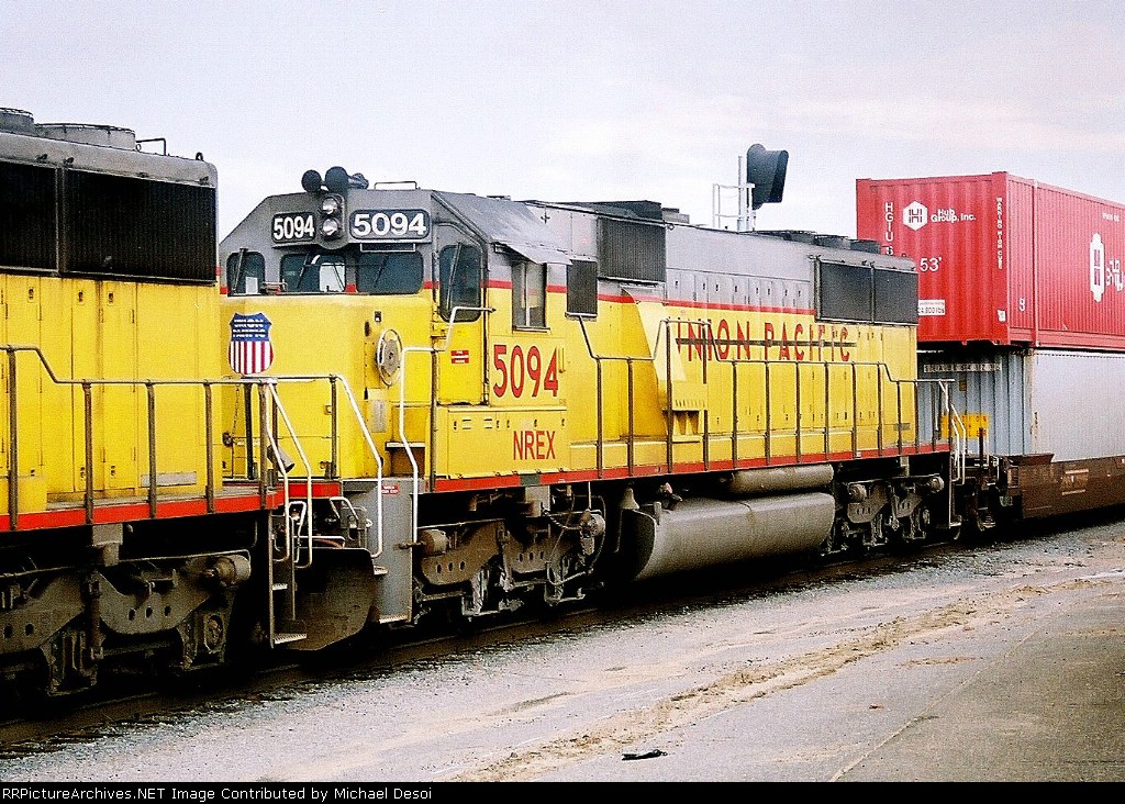 NREX SD-50 #5094 is third out on this westbound consist leaving the yard